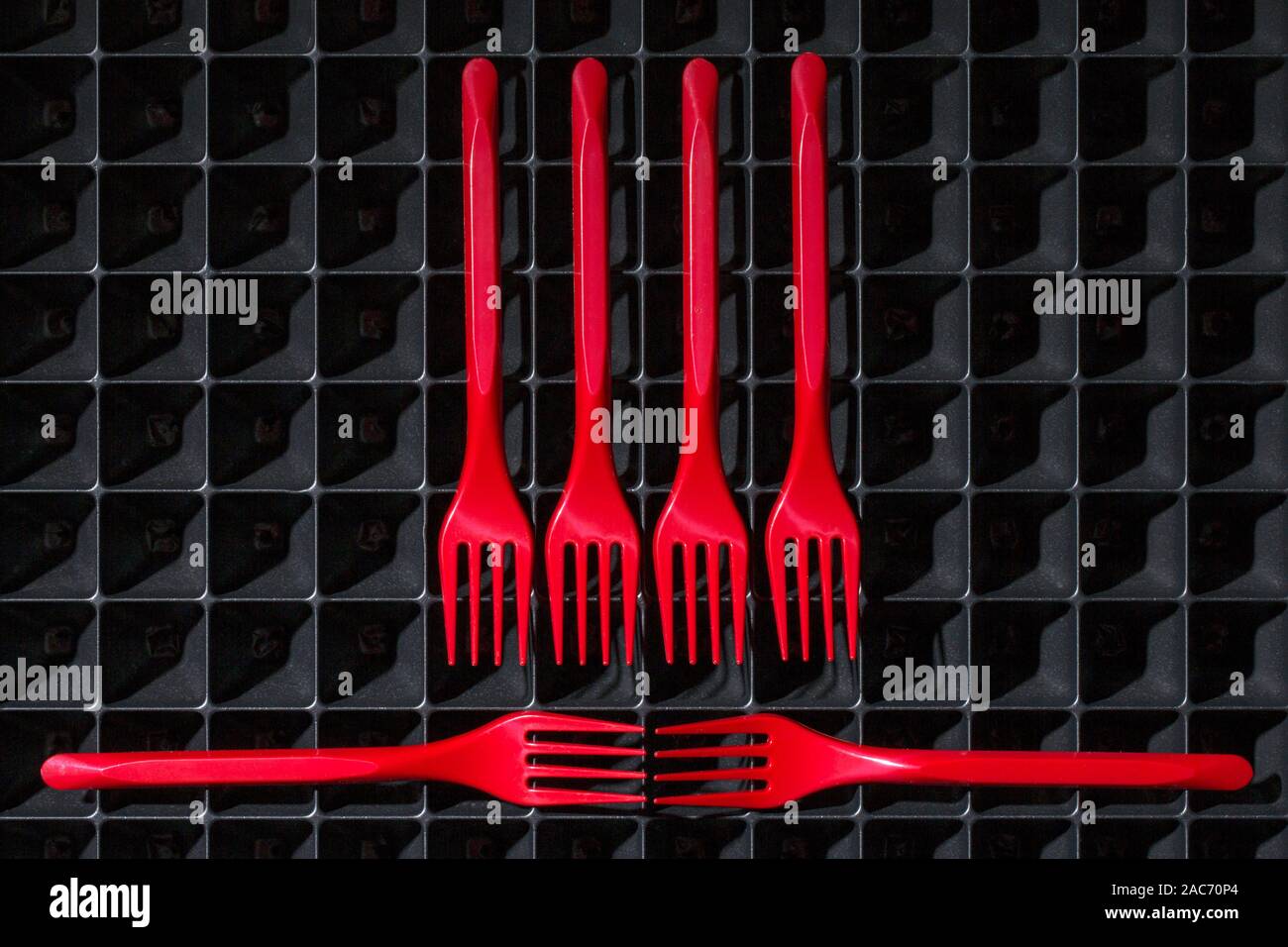 Very simple still life with forks on black background Stock Photo - Alamy