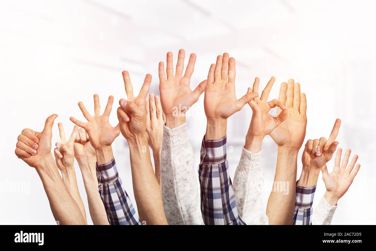 Row raised hands showing different hi-res stock photography and images ...