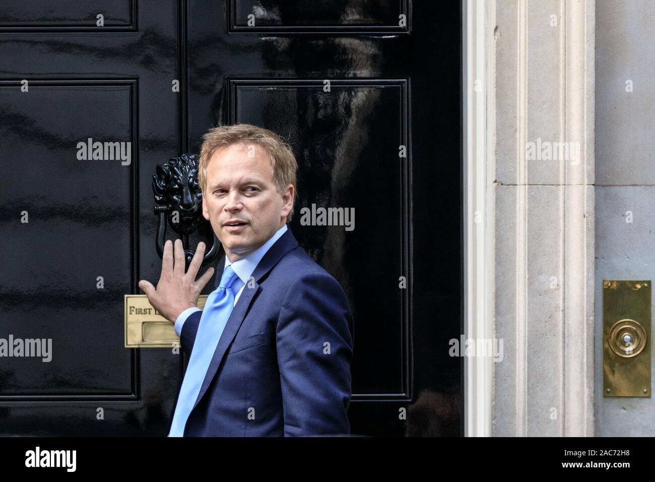 Grant Shapps MP, Cabinet Minister, turns around at the iconic black ...