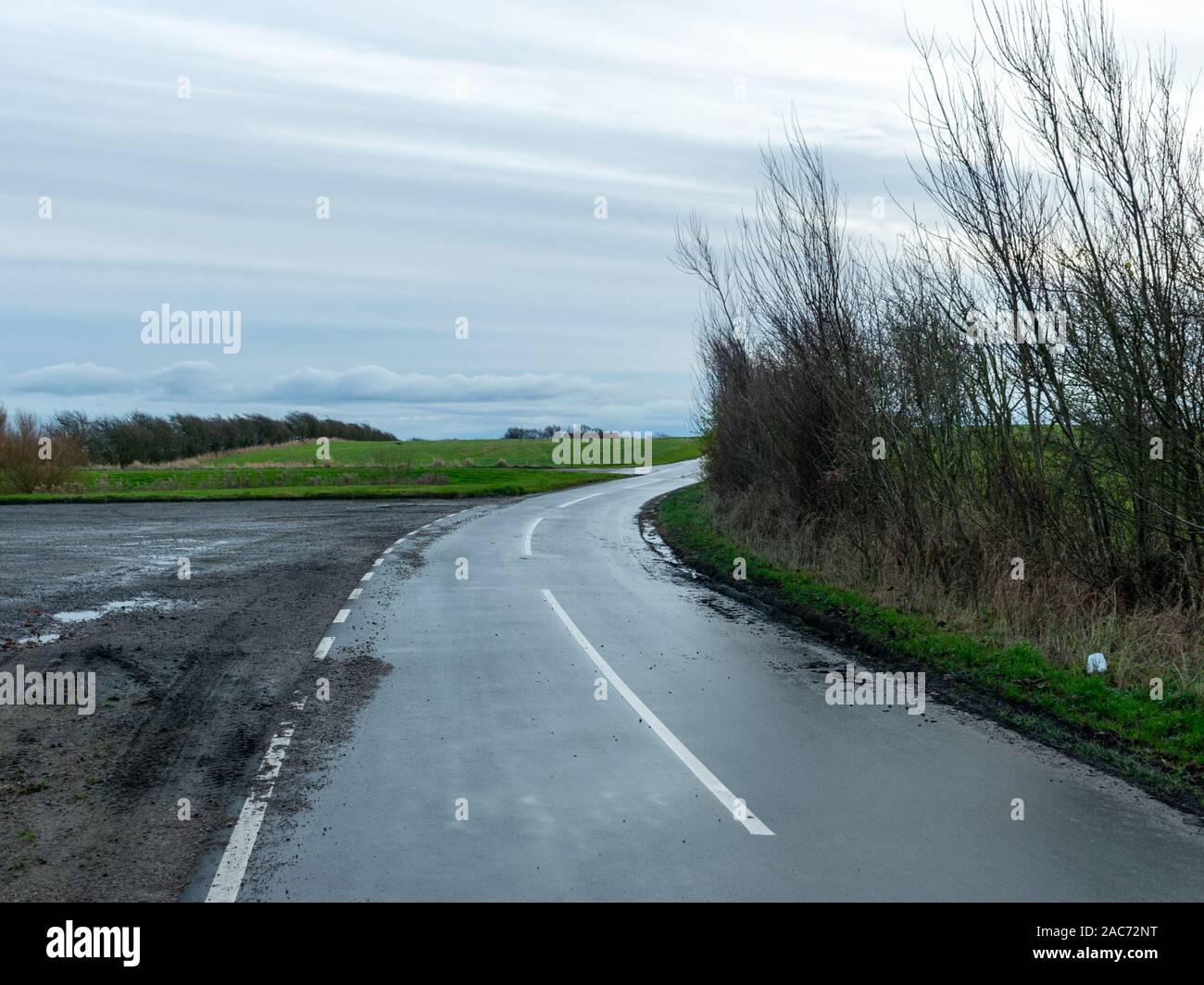 landscape with a wet asphalt road Stock Photo - Alamy