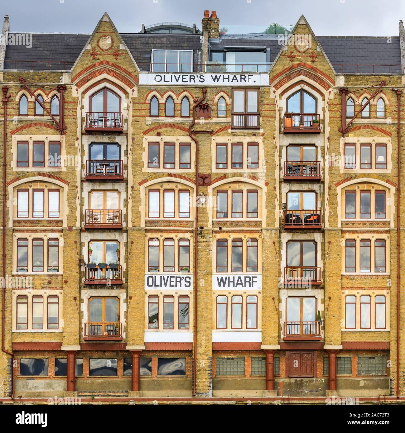 Oliver's Wharf converted wharf building exterior on the River Thames in ...