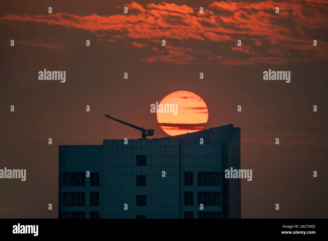 Sunset behind building Stock Photo - Alamy