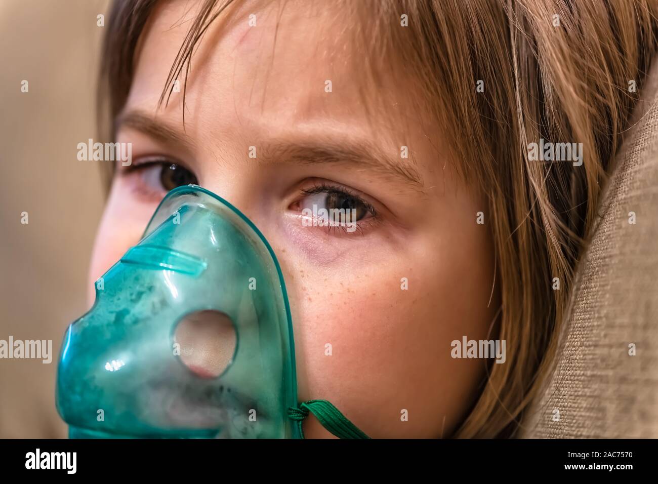 Cute baby girl breathes through nebulizer inhaler Stock Photo - Alamy