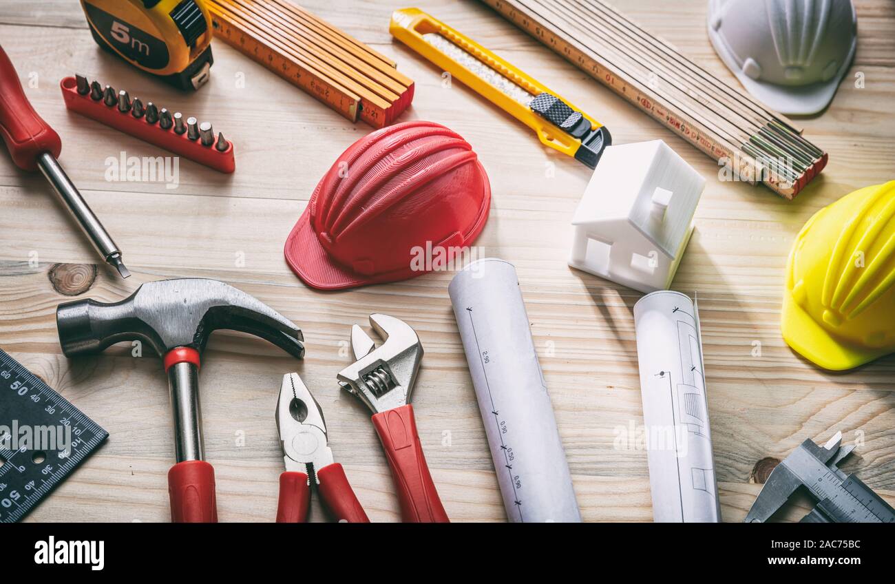 Construction, house renovation concept. Hand tools, hard hats and ...