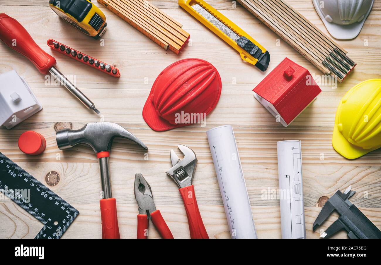 Construction, house renovation concept. Hand tools, hard hats and ...