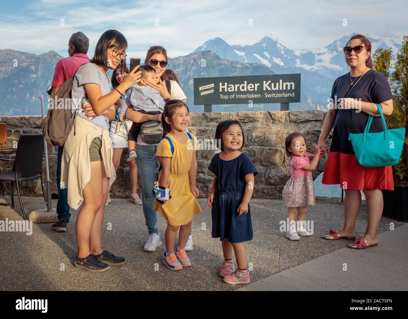 A Chinese family takes a picture in Harder Kulm, Interlaken ...