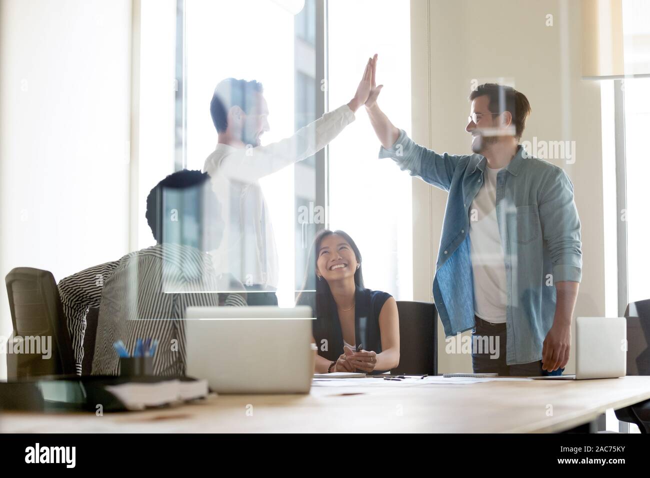 Colleagues giving high five greeting each other or express respect ...