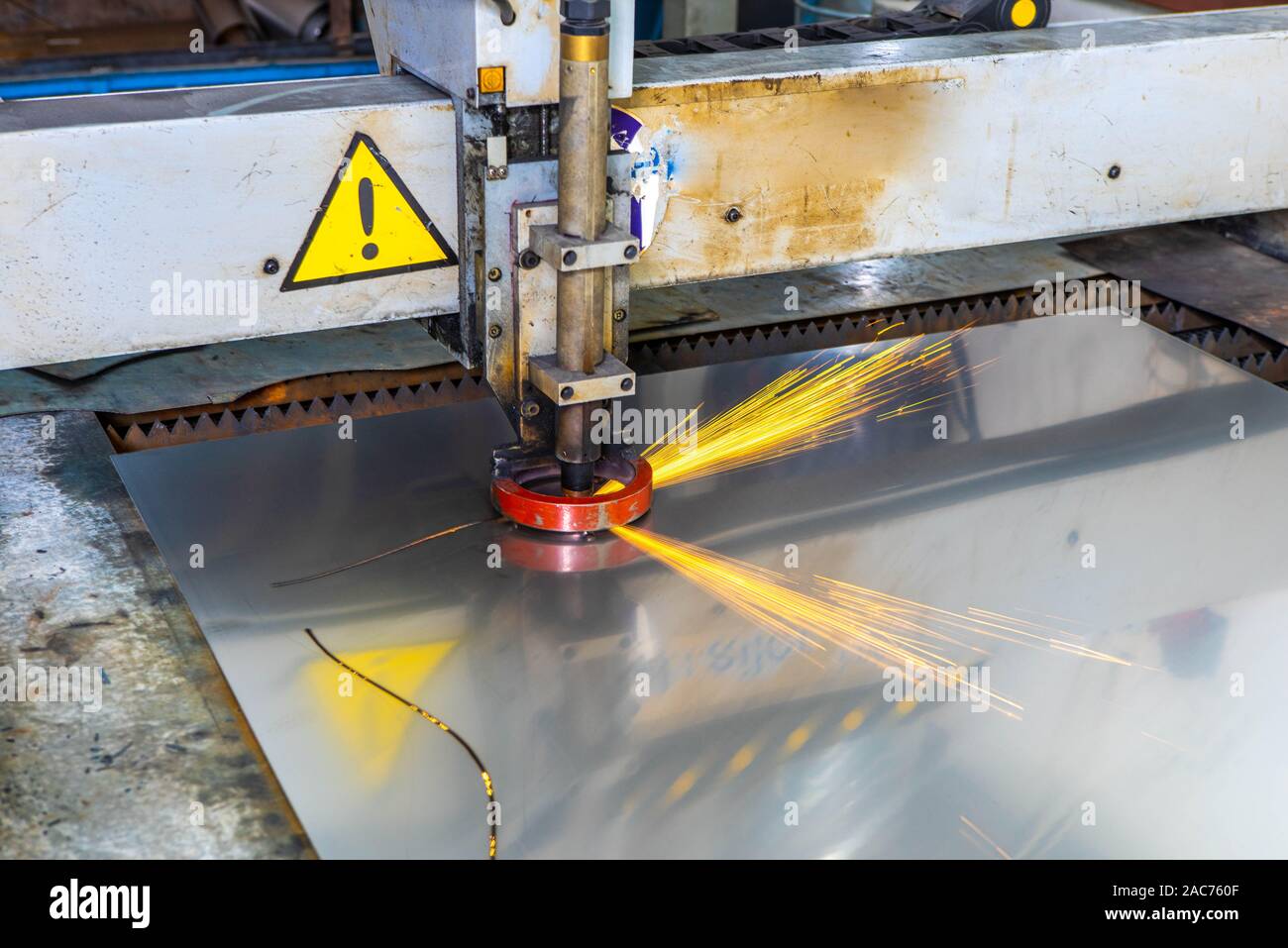 CLose-up of working metal processing machine. Plasma metal cutting ...