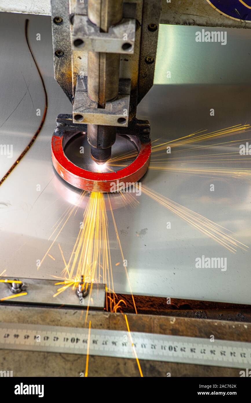 CLose-up of working metal processing machine. Plasma metal cutting ...