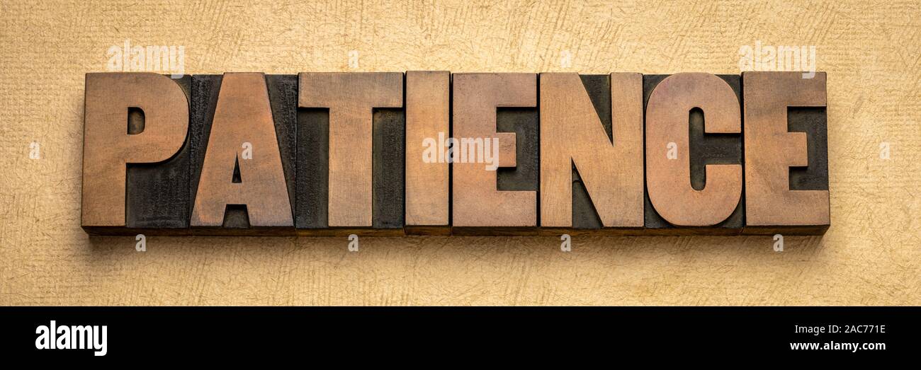 patience word in vintage letterpress wood type blocks against handmade ...