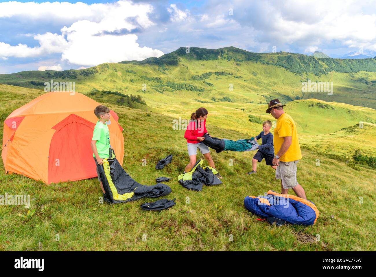 Tent setup for an overnight stay in the mountains Stock Photo - Alamy