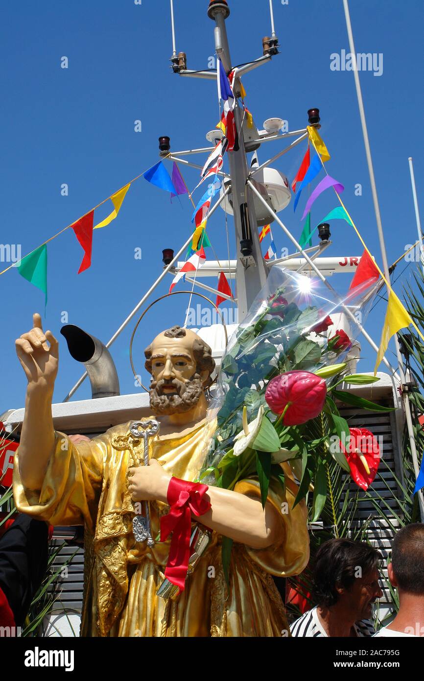 Statue of St. Peter, patron saint of fishermen, carried in procession ...