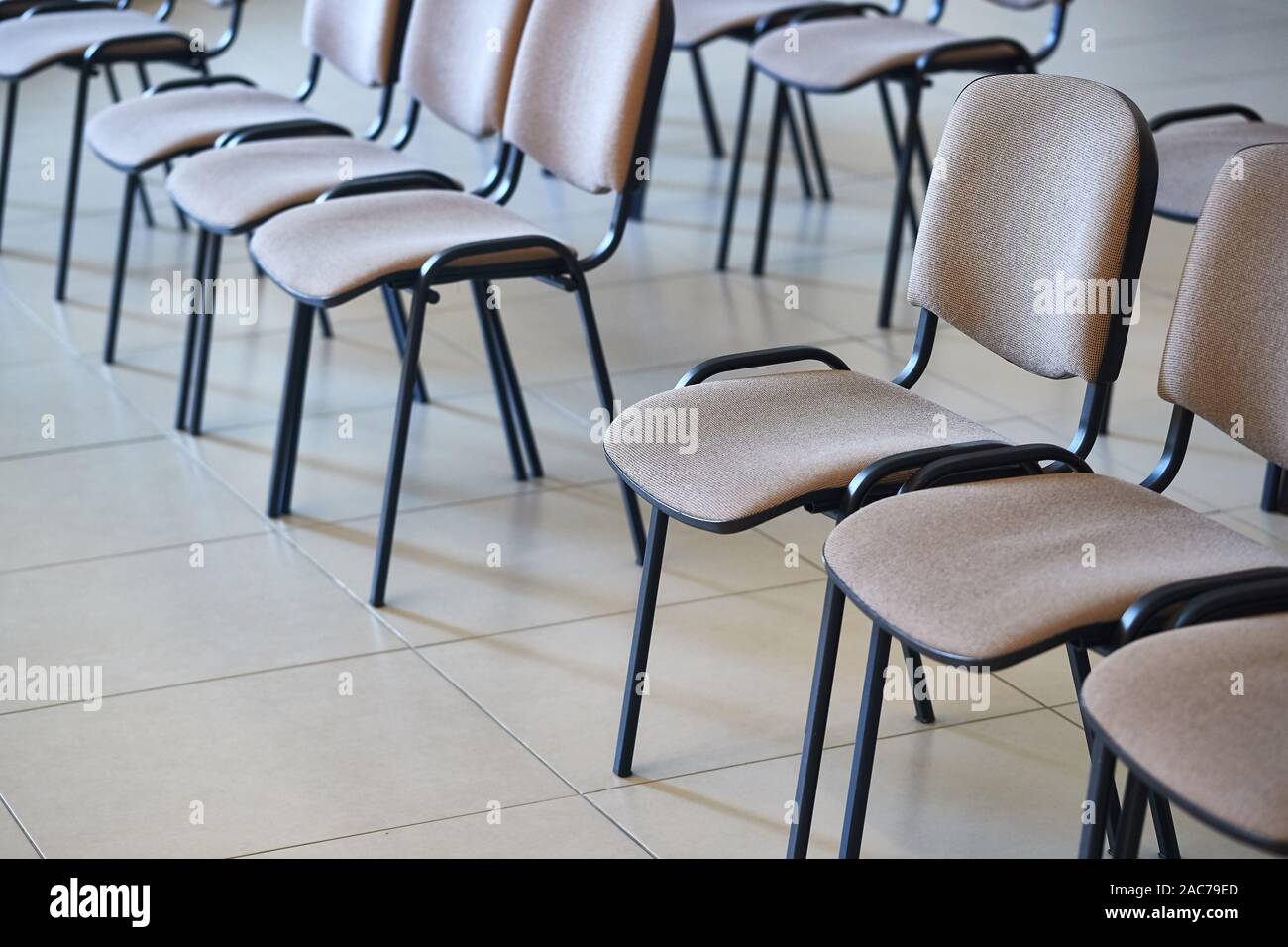 Row of empty small chairs hi-res stock photography and images - Alamy