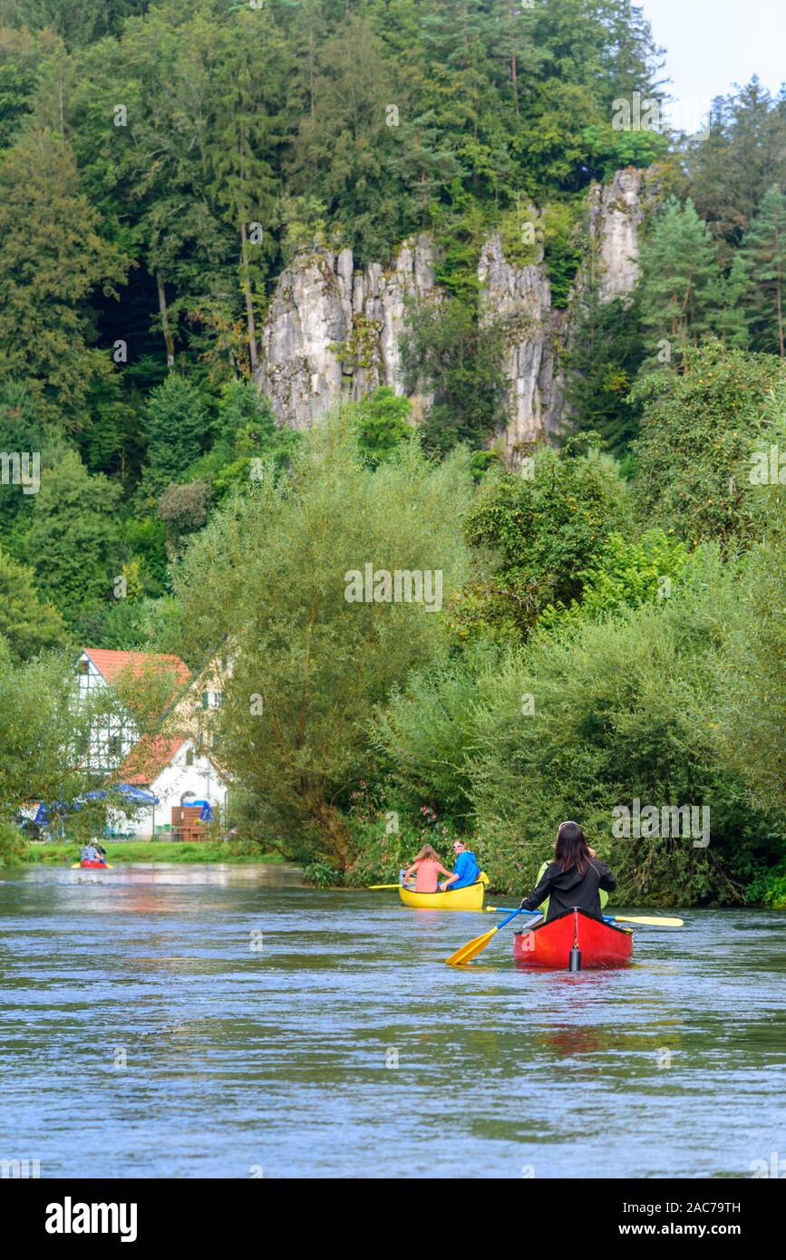 Group of people doing canoe tour on idyllic river in franconia Stock ...