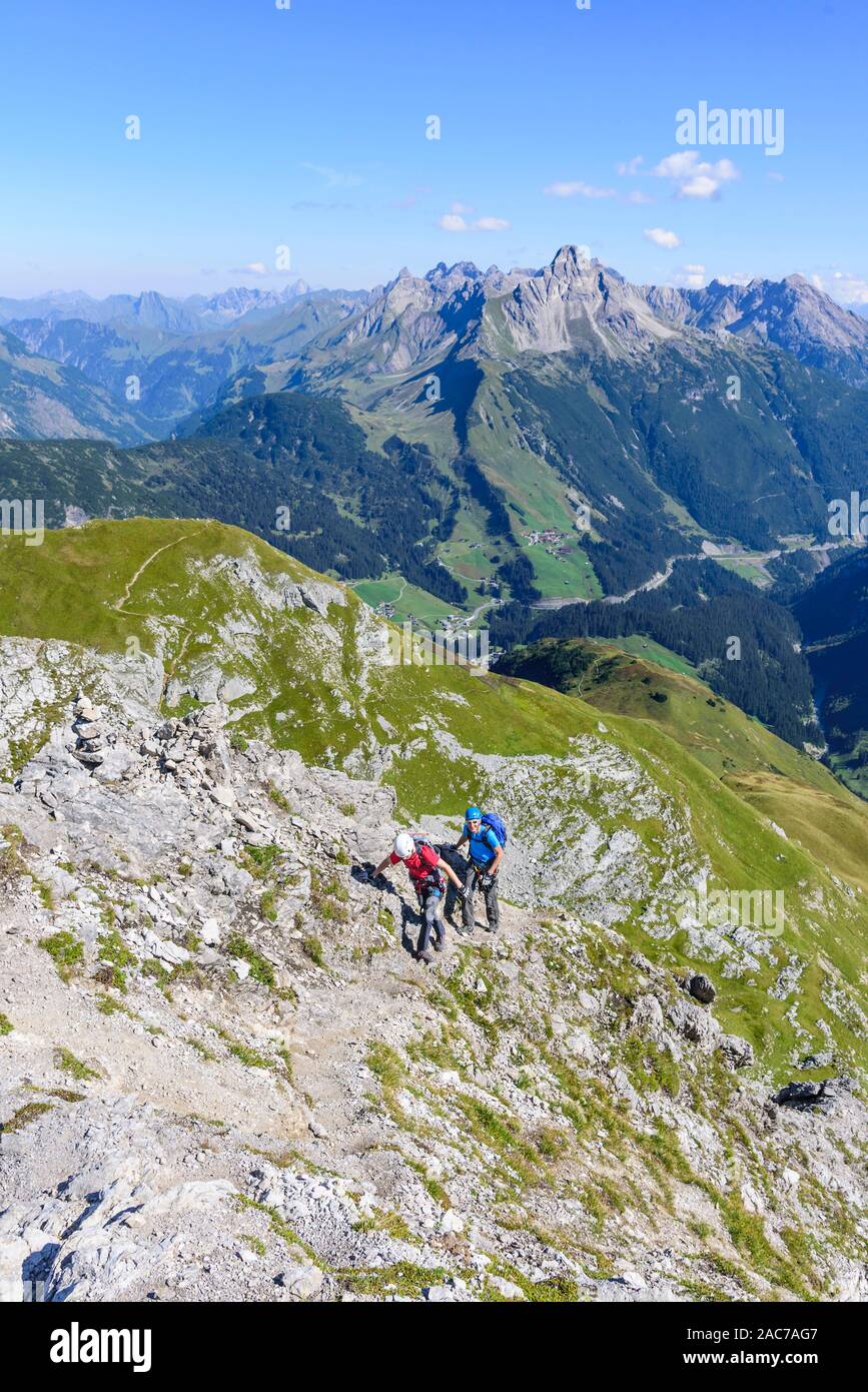 Climbing in via ferrata style in high alpine region in western Austria ...