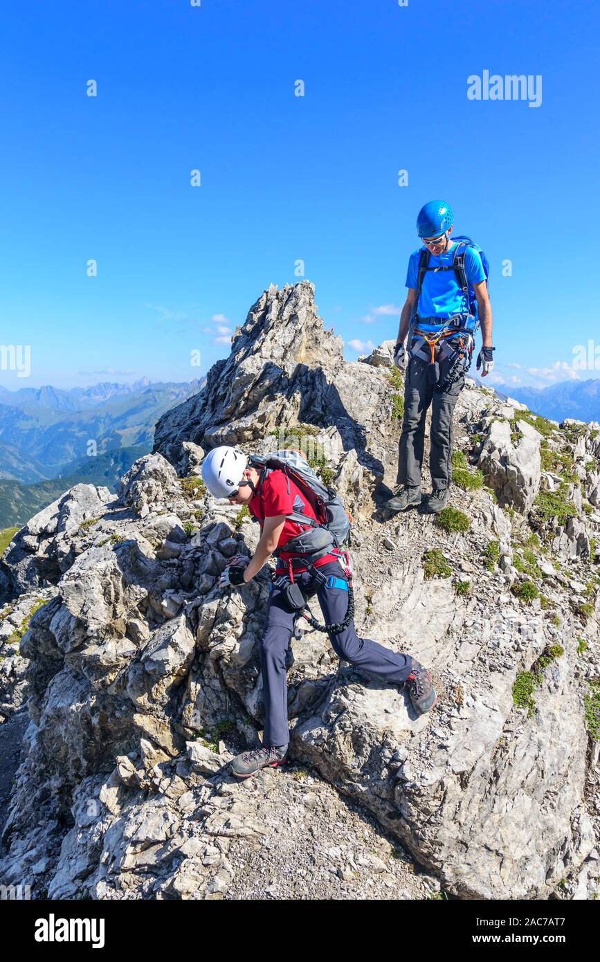 Climbing in via ferrata style in high alpine region in western Austria ...