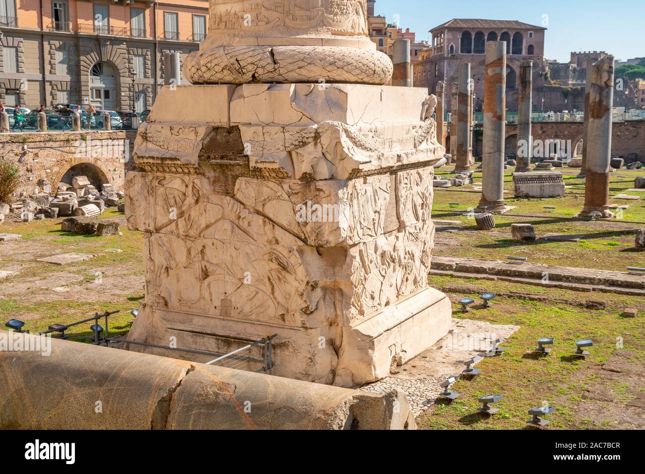 Traian Column detail with ruins of Cesar Forum in Rome. bottom of ...