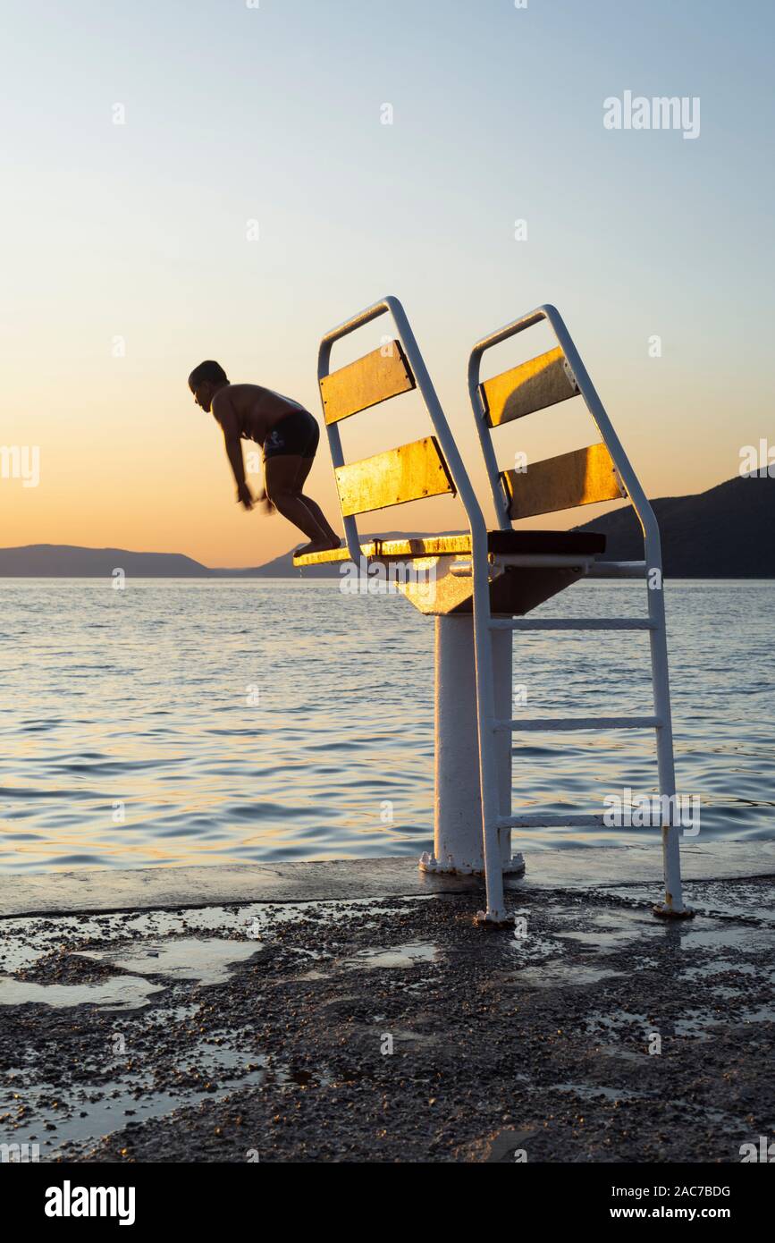 Boy on diving platform hi-res stock photography and images - Alamy