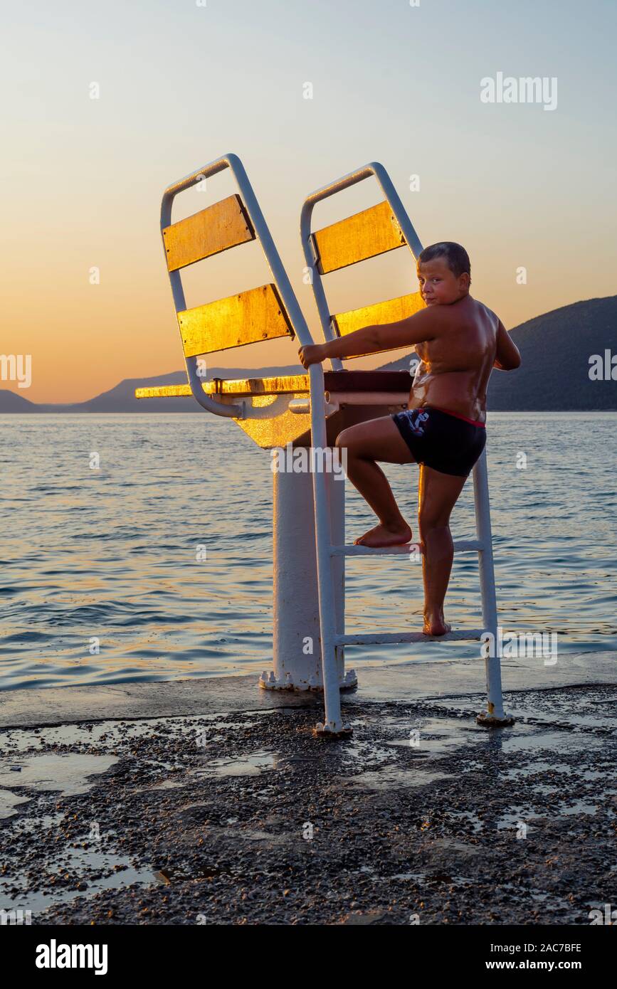 Boy on diving platform hi-res stock photography and images - Alamy