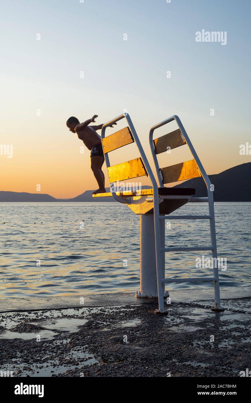 Boy on diving platform hi-res stock photography and images - Alamy