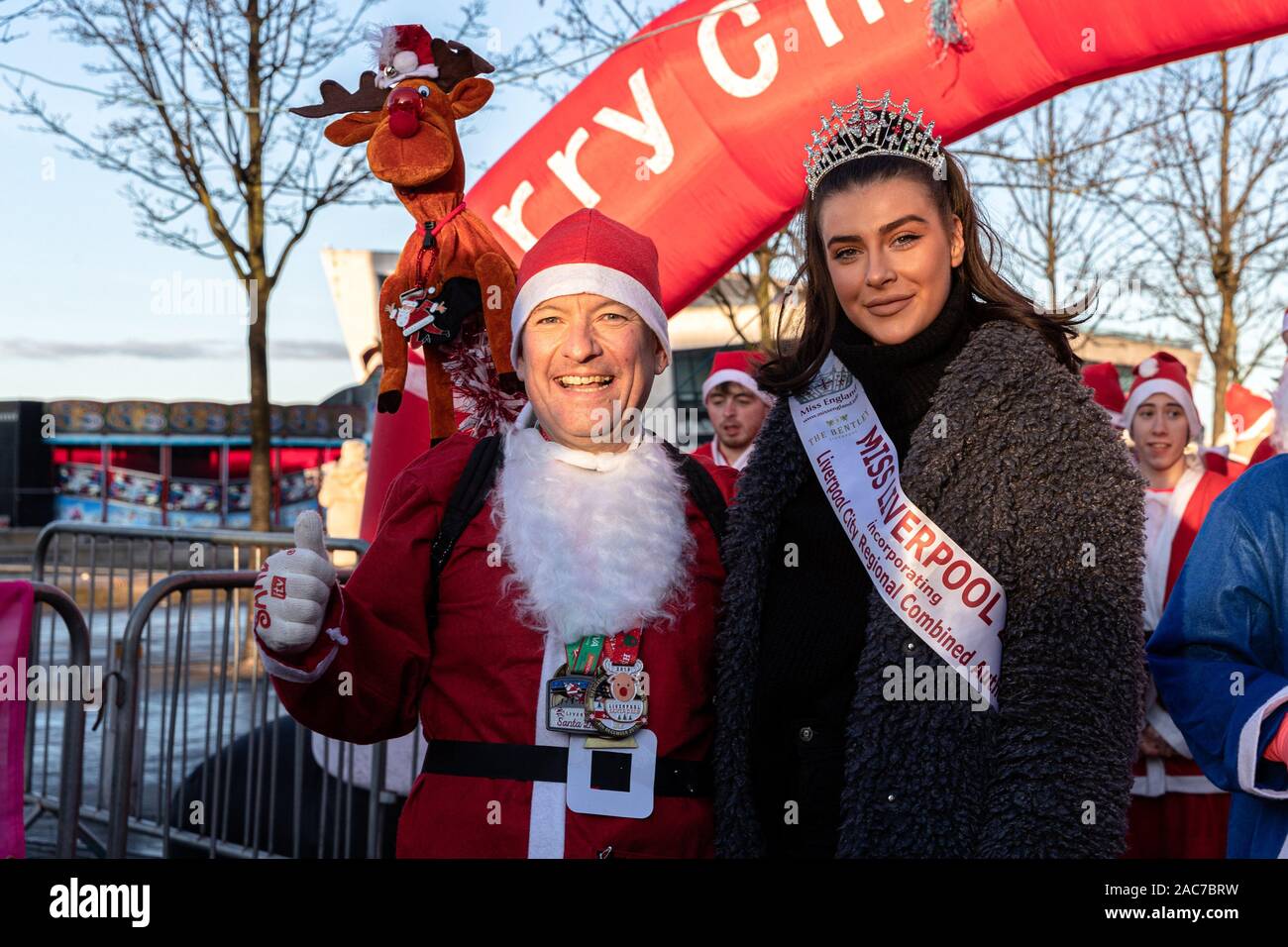 December 1, 2019: Miss LIverpool and friend start the annual Santa Dash ...
