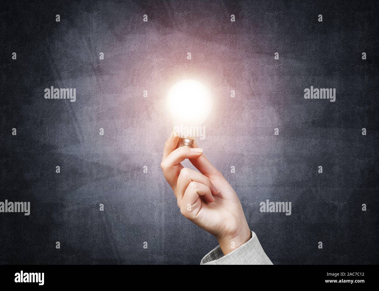 Human hand with glowing incandescent lamp Stock Photo - Alamy