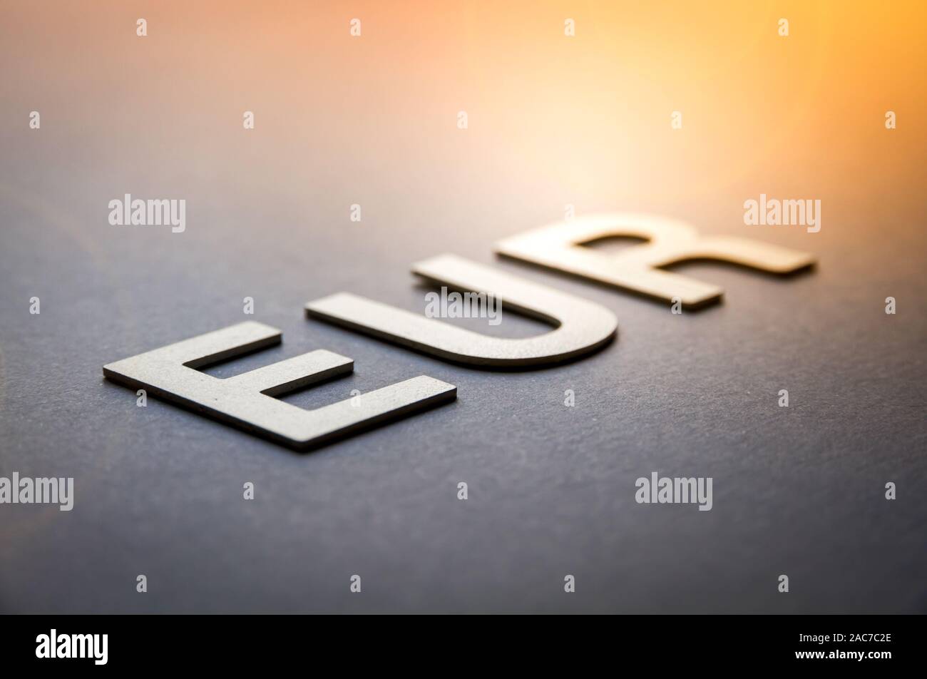 Word EUR written with white solid letters on a board Stock Photo - Alamy