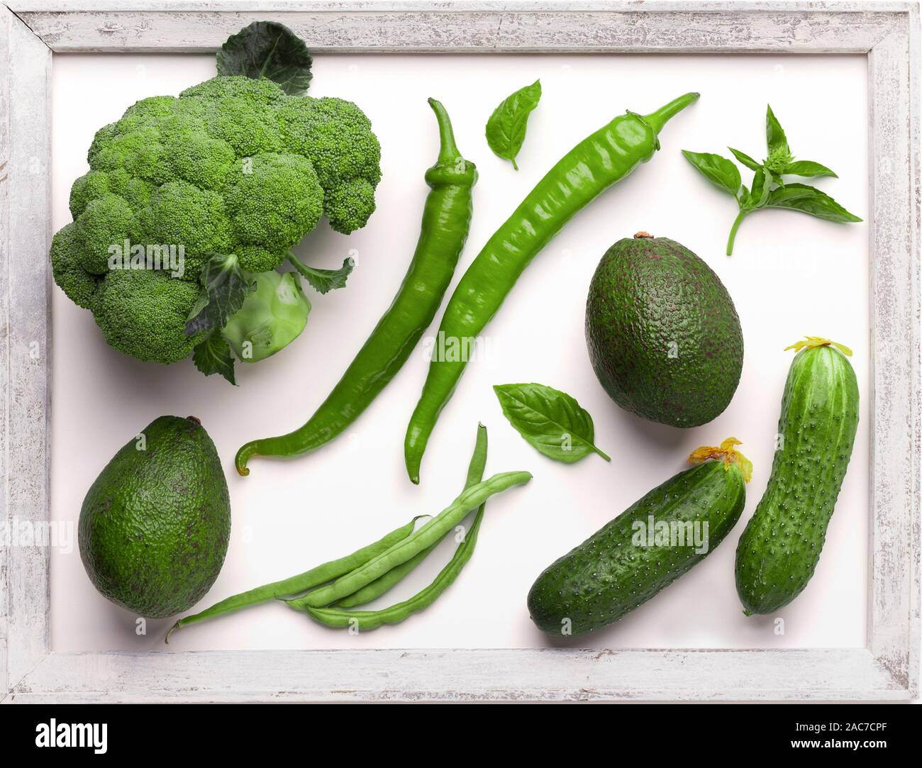 Creative picture of green vegetables inside wooden frame Stock Photo ...