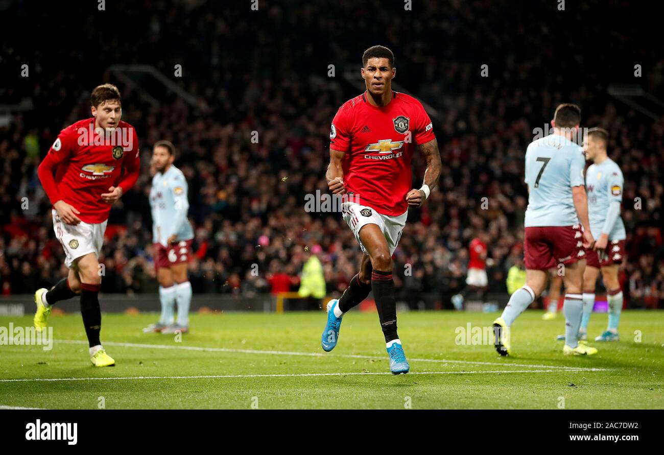 Manchester United's Marcus Rashford (right) celebrates scoring his side ...