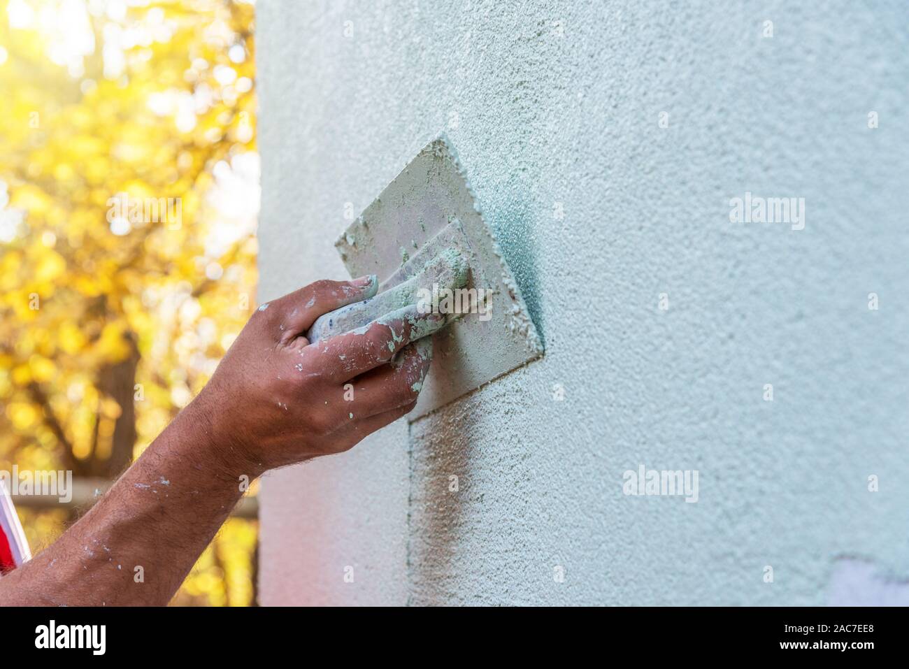 Application Of Facade Plaster,Worker Plastering The Facade Of The ...