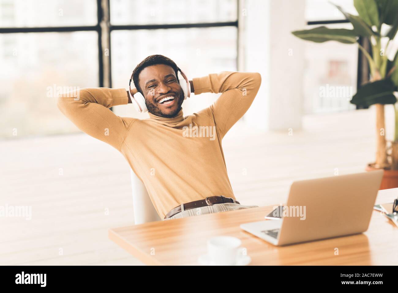 Relaxed african american student listening hi-res stock photography and ...