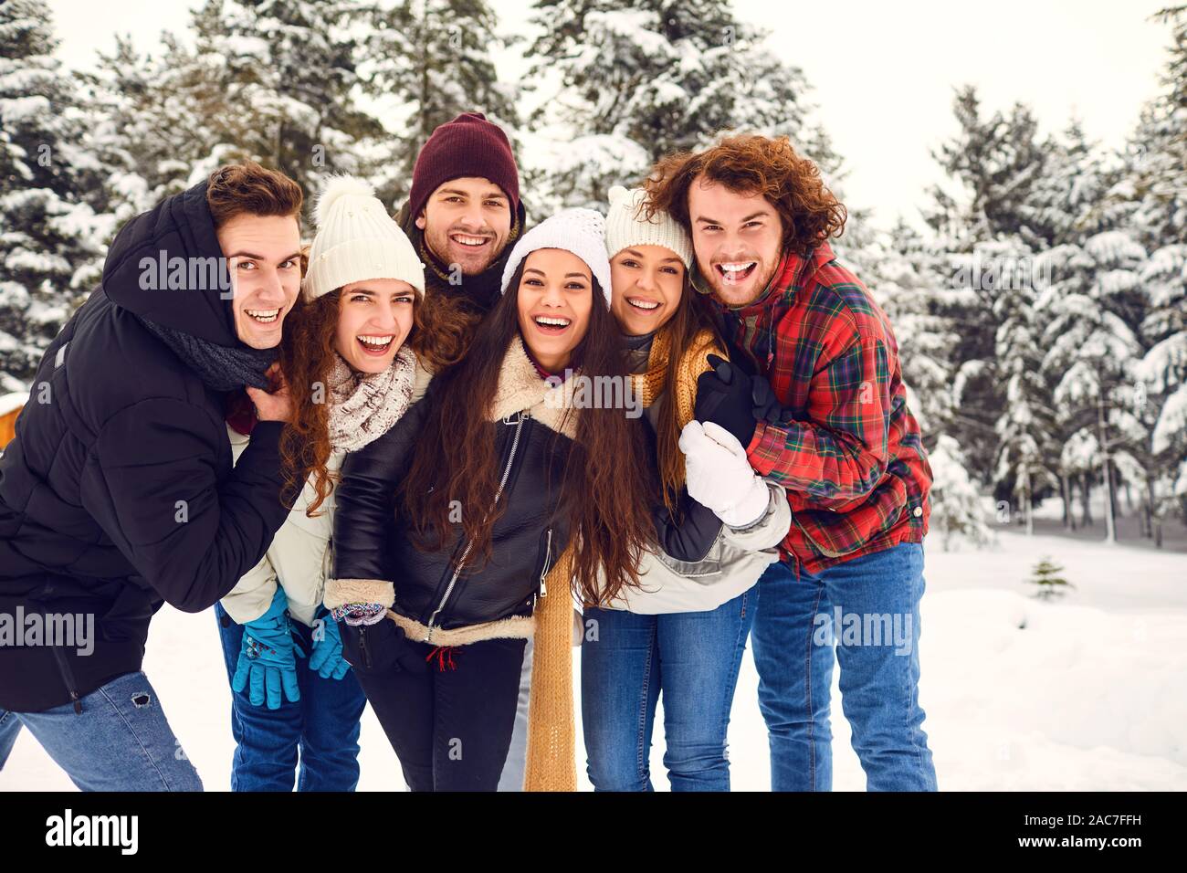 Group of friends in the park in winter Stock Photo - Alamy