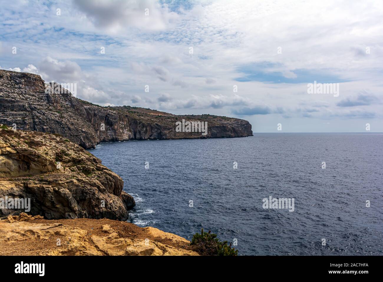 Massive cliff walls and the rugged coast in the South of Malta Stock ...