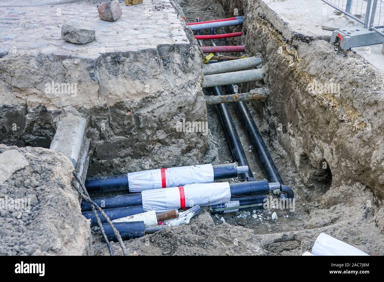 replacement of underground district heating pipes on city street Stock ...