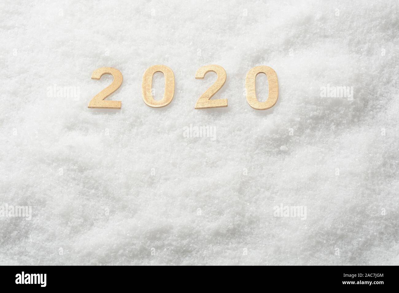 New Year 2020 in numbers on snow background, white and yellow colors ...