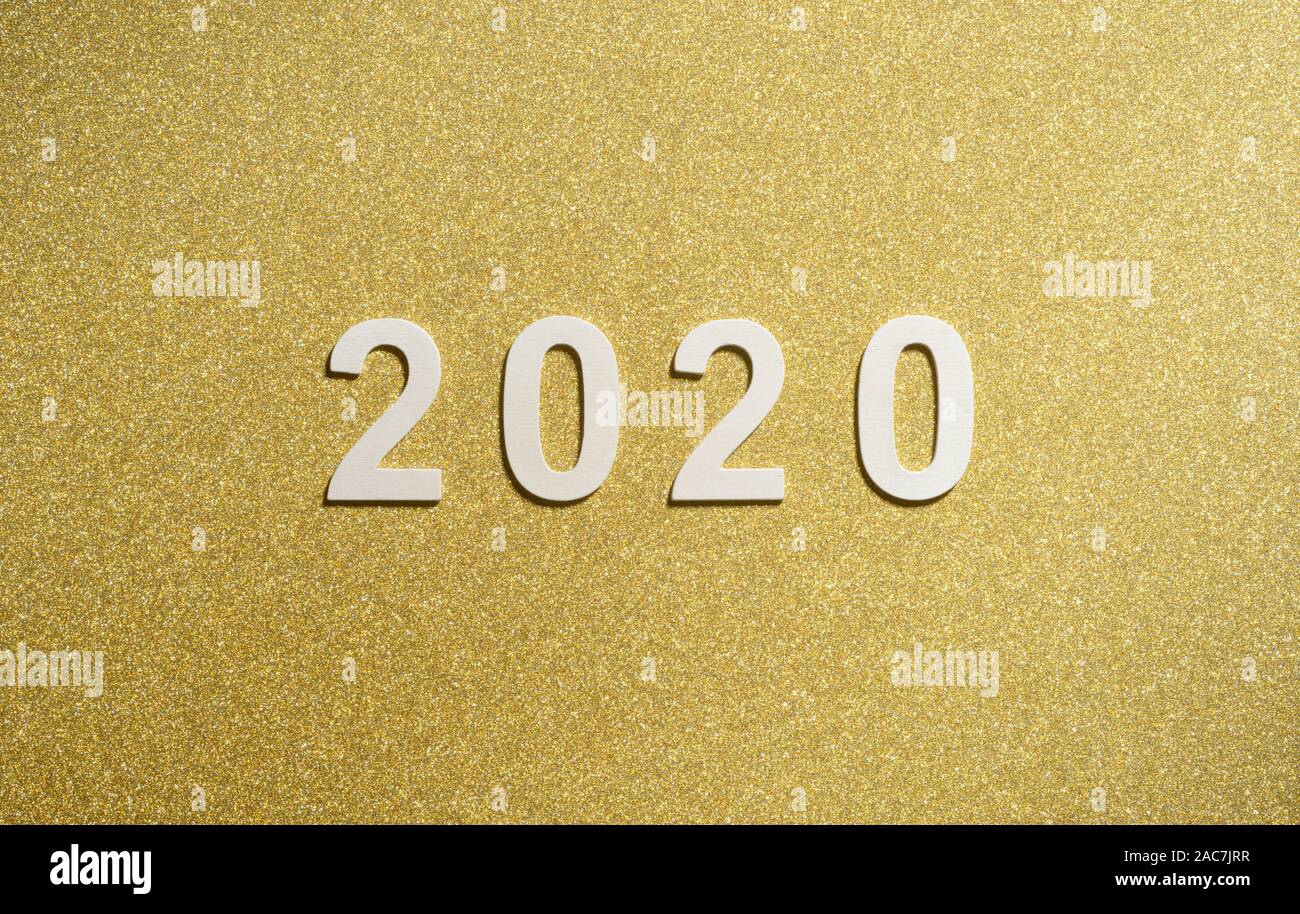 2020 year in white numbers on golden or yellow background Stock Photo ...