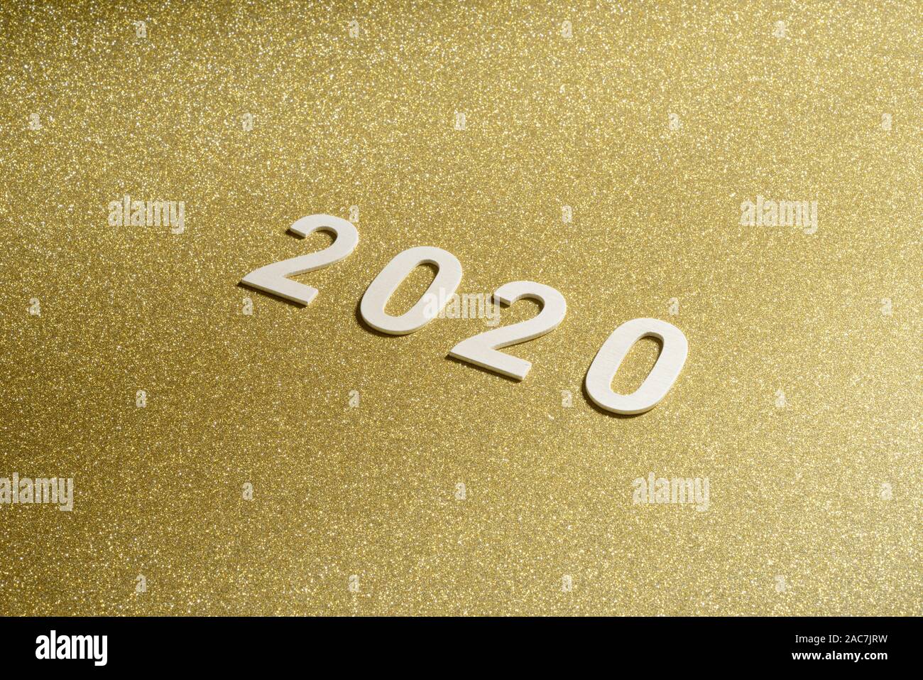 2020 year in white numbers on golden or yellow background Stock Photo ...