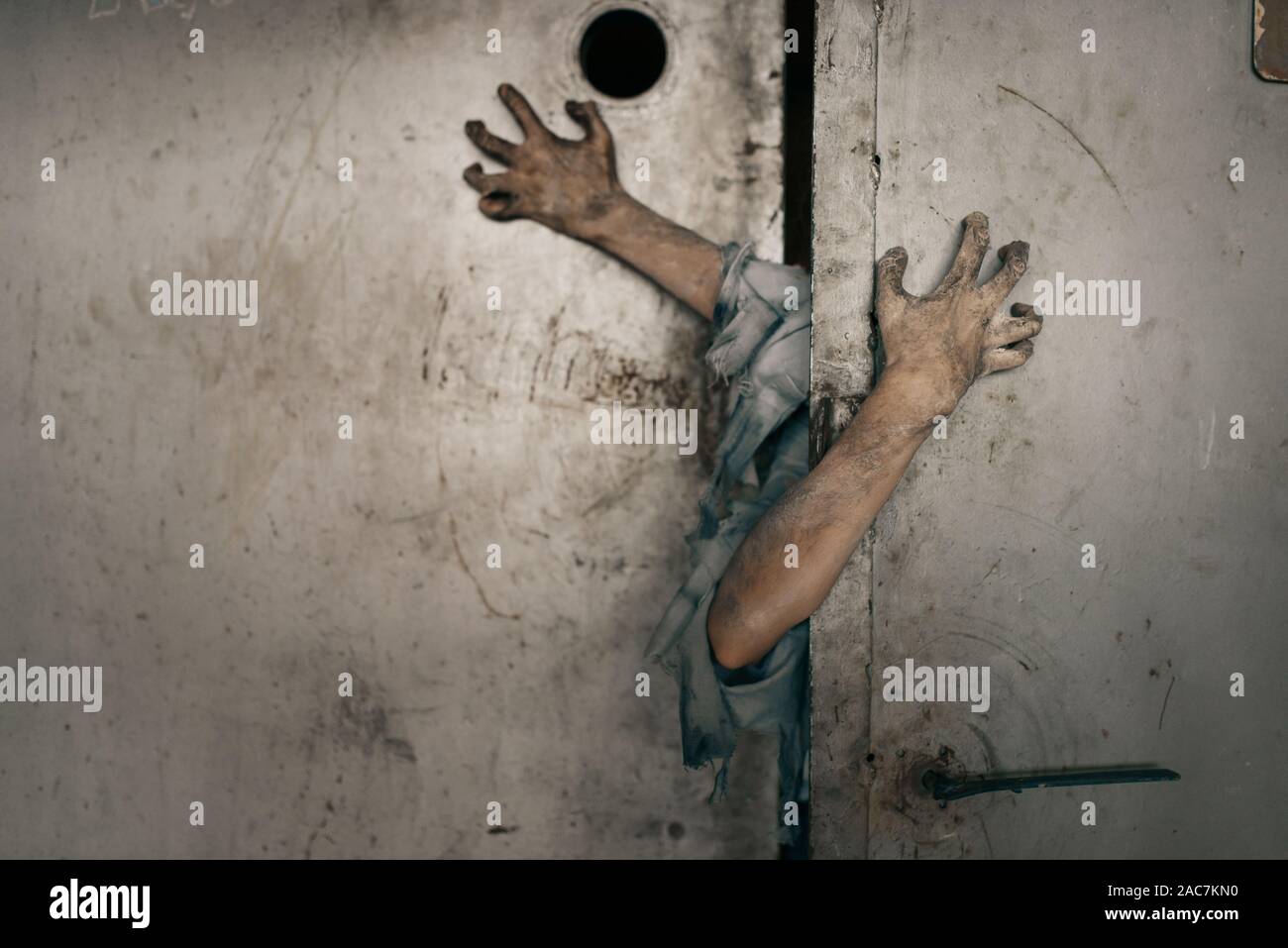 Zombie hands sticking out of the elevator door Stock Photo - Alamy