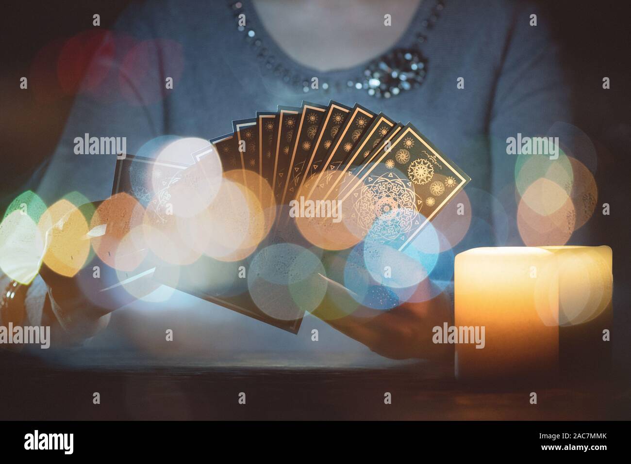 Fortune teller with tarot cards in hands close up. Future reading ...