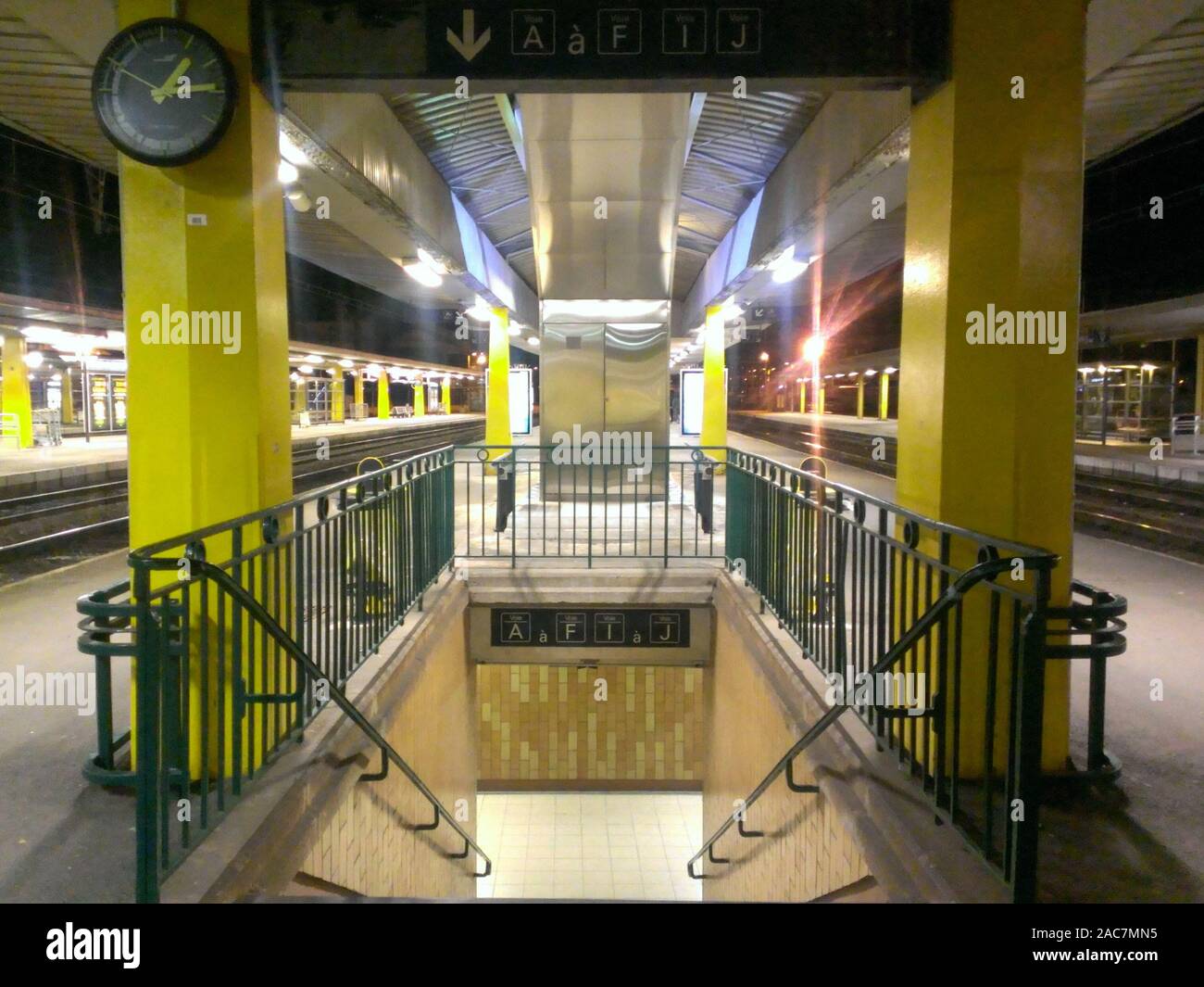Yellow train station stairs the evening Stock Photo - Alamy