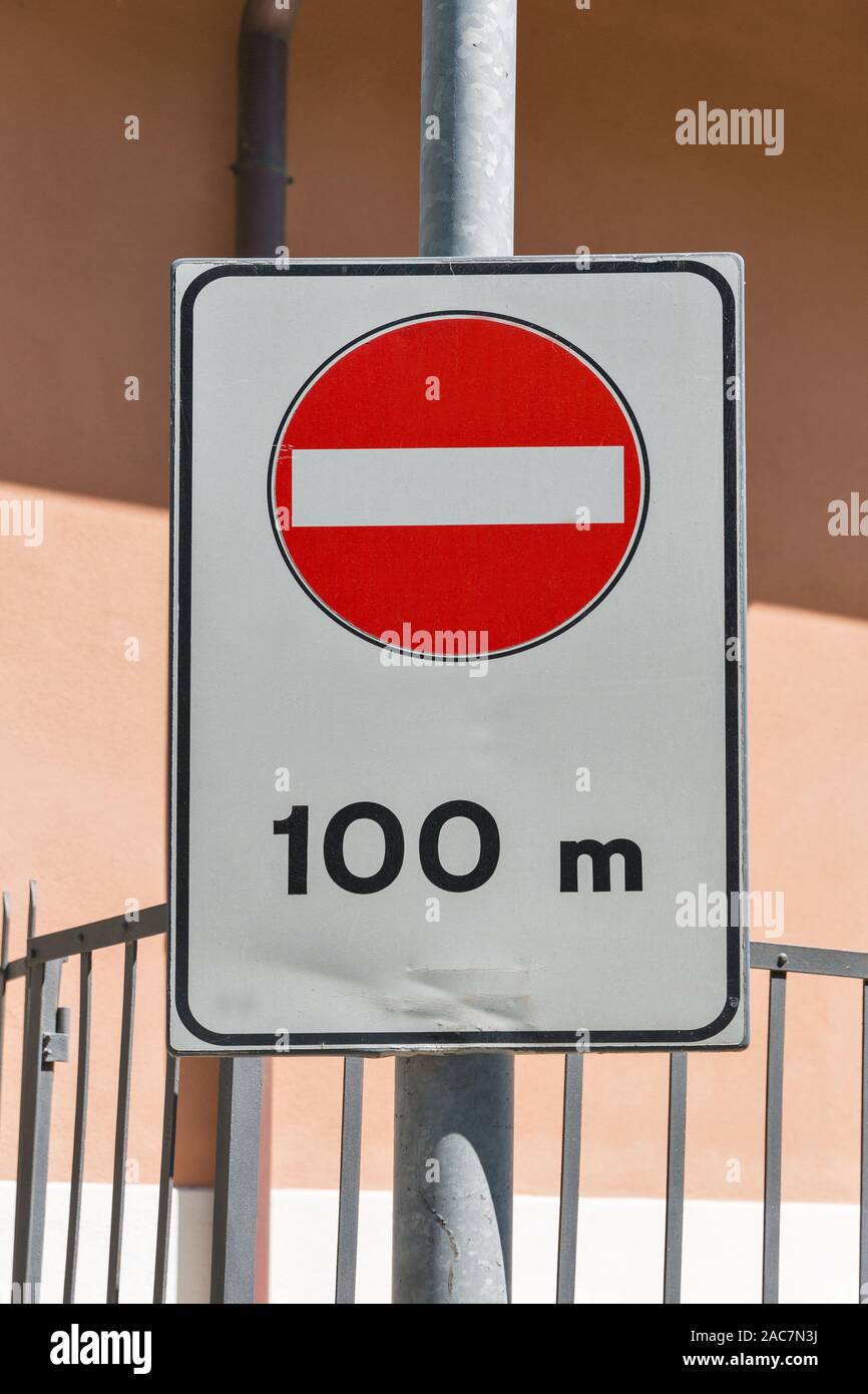 No entry after 100 m traffic road sign closeup outdoor on metal pole ...