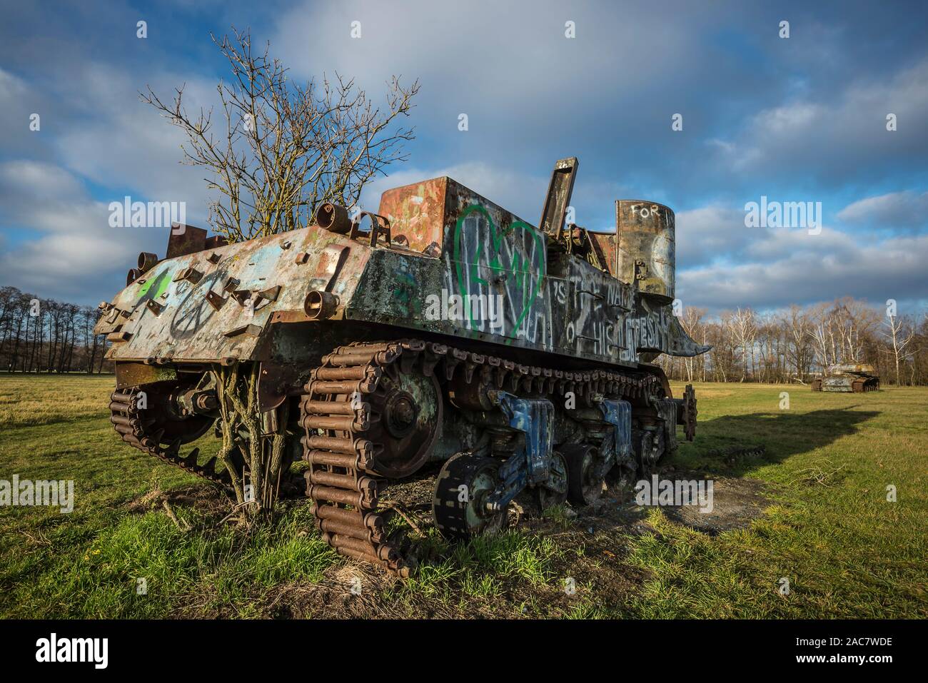 Target tank with graffiti on a meadow Stock Photo - Alamy