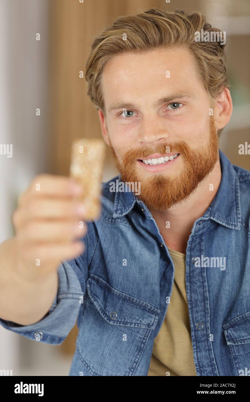 Man eating cereal bar hi-res stock photography and images - Alamy