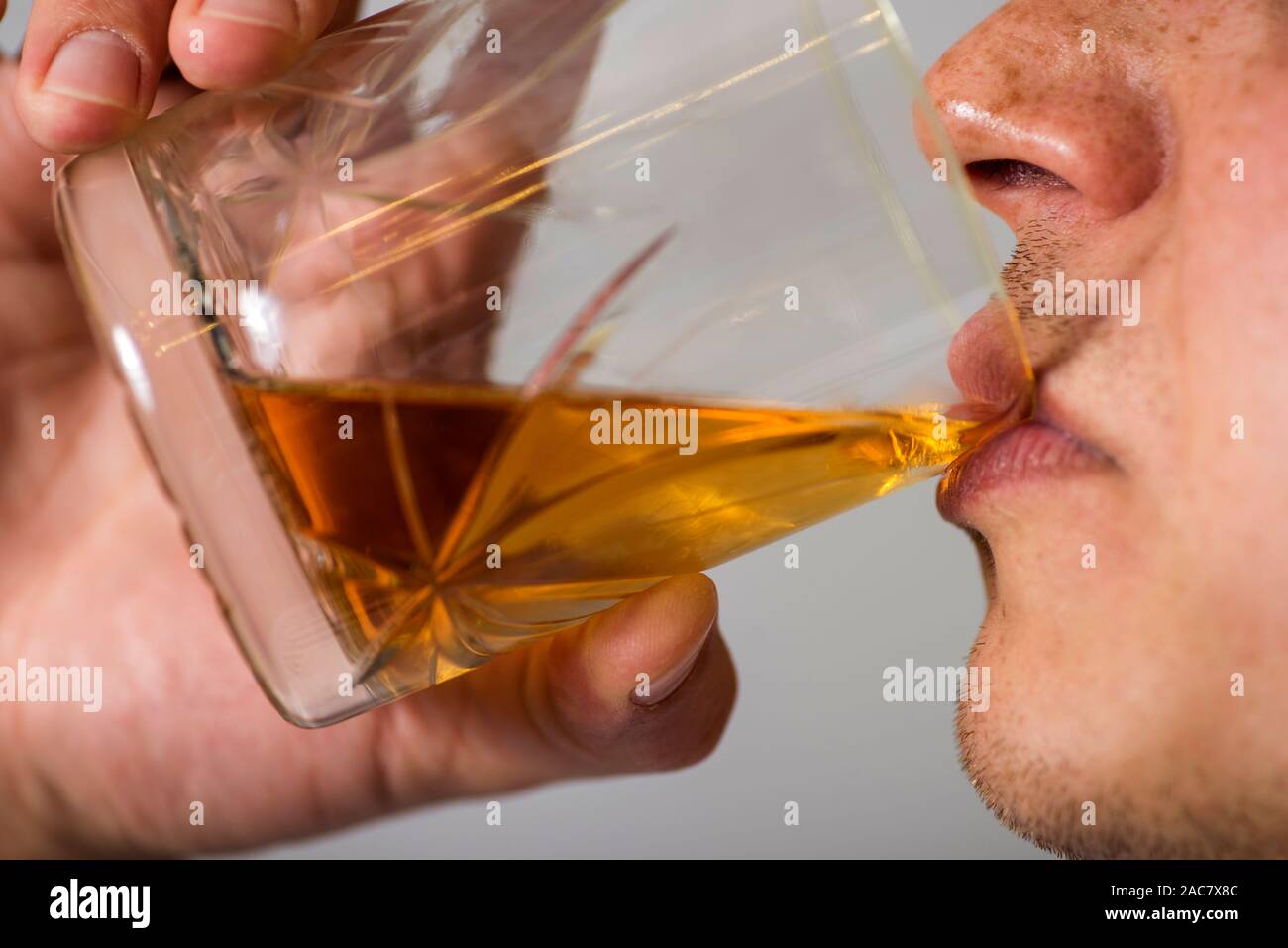 Man is drinking alcohol. People, drinks, alcohol and leisure concept ...