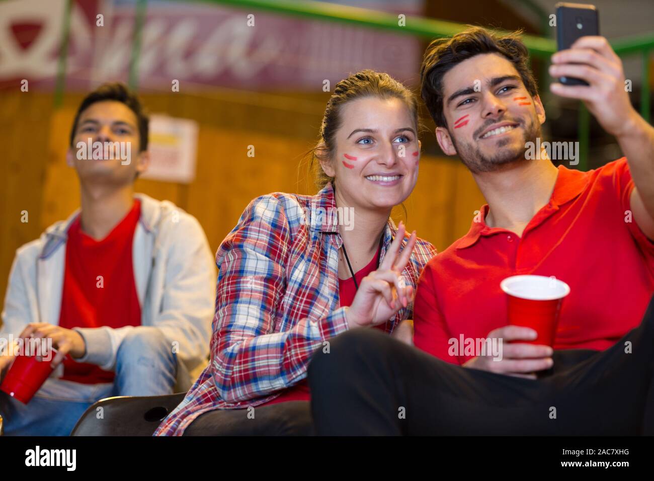 portrait of club fans taking selfie Stock Photo - Alamy
