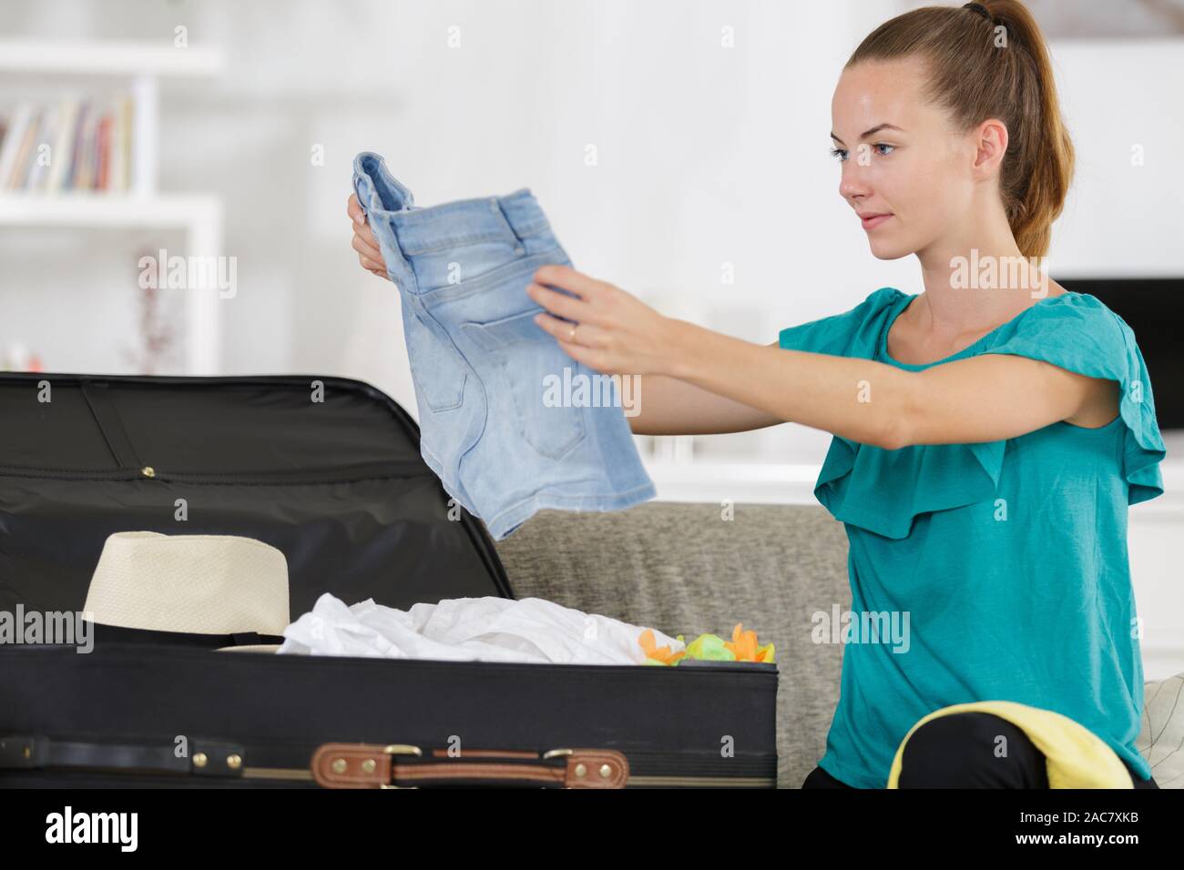 Unpacking a suitcase hi-res stock photography and images - Alamy