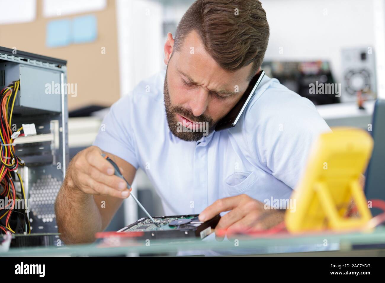 technician using multimeter in a pc Stock Photo - Alamy