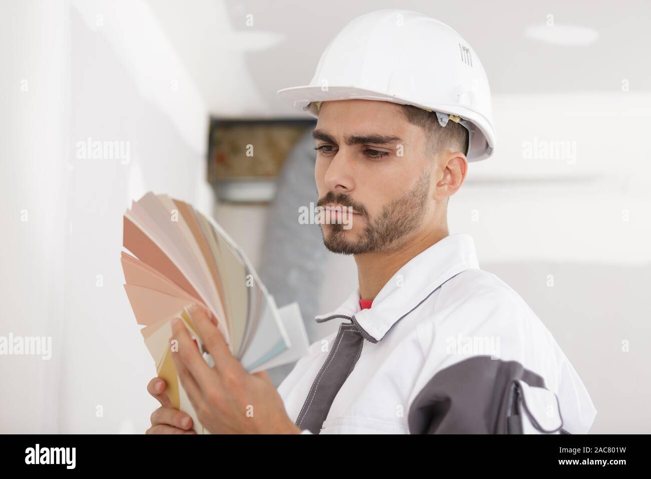 painter man with color swatches Stock Photo - Alamy