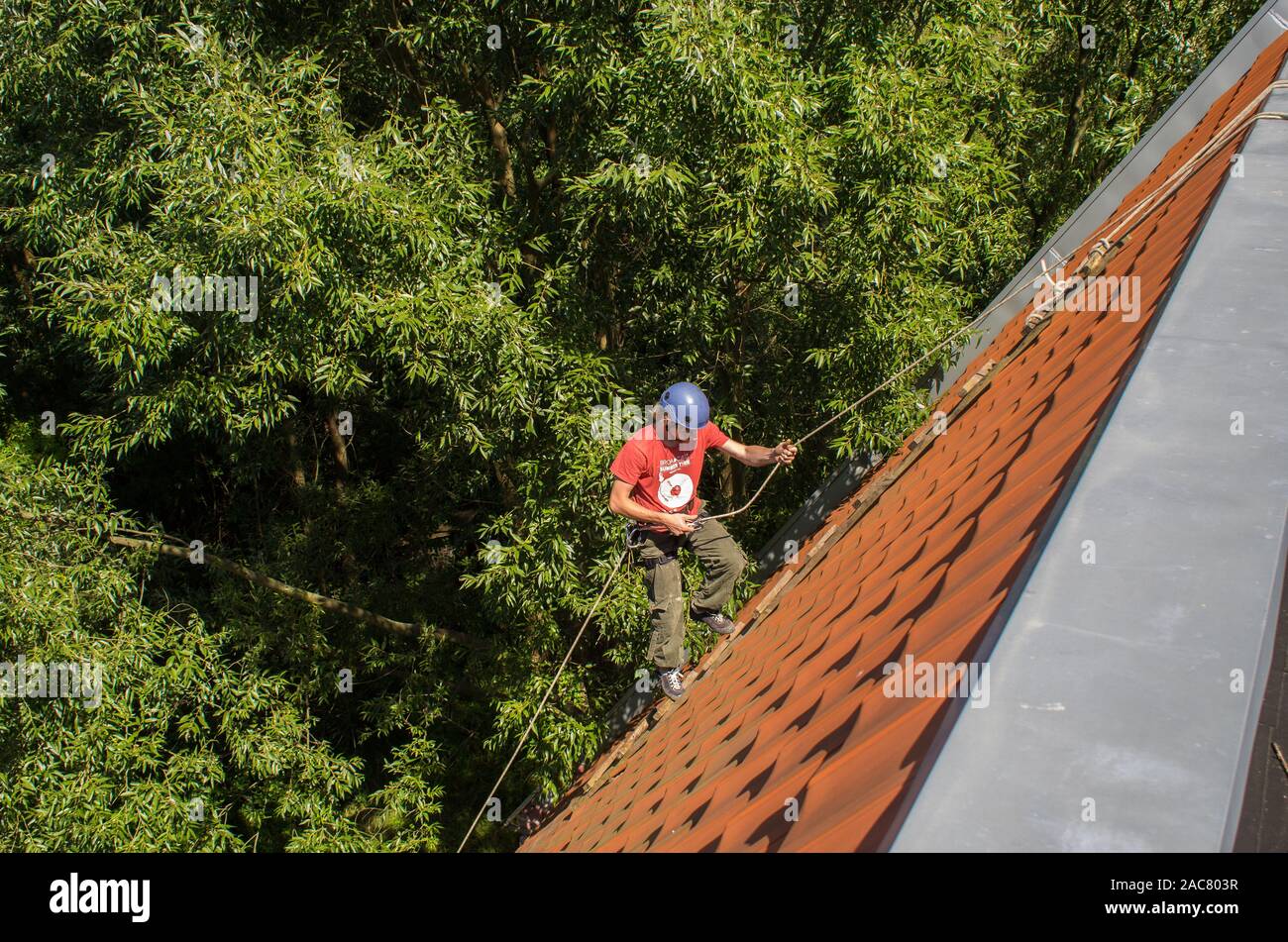 Climbing roof ladder hi-res stock photography and images - Alamy