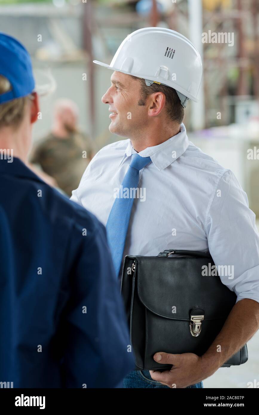 senior elegant builder man in suit at construction site Stock Photo - Alamy
